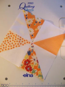 One Charm Pack Quilt Pattern With Pinwheels Framed In Prairie Points ...